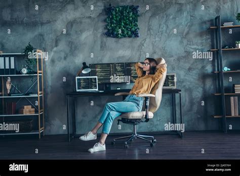 Portrait Of Attractive Dreamy Girl Technician Web Developer Sitting In