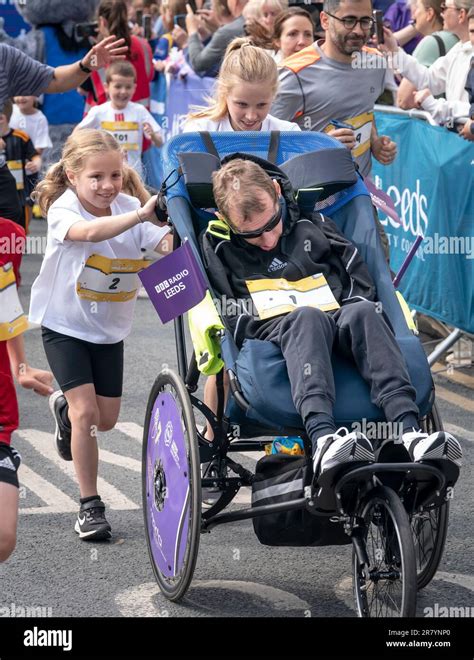Rob Burrow Is Pushed By His Daughters Maya Left 8 And Macy Right 11 During The Start Of