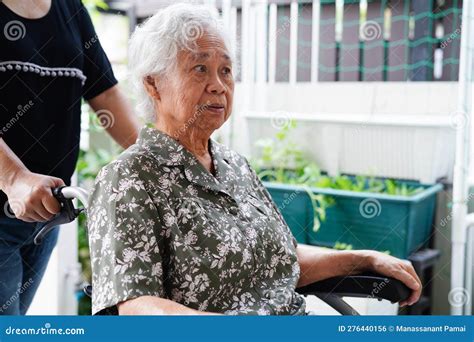 Caregiver Help Asian Elderly Woman Disability Patient Sitting On