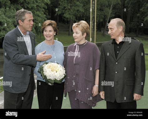 U S President George W Bush Left And His Wife Laura Second Left And