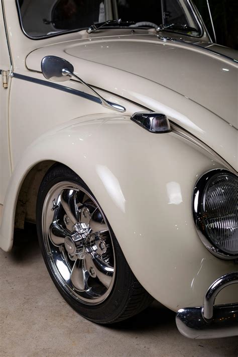 Yellow Volkswagen Beetle Coupe Parked On Gray Concrete Surface · Free