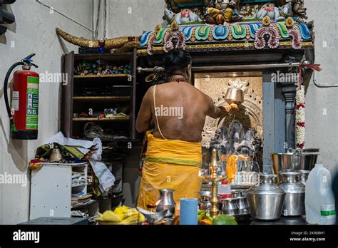 A Pandit Or Hindu Priest Performs Abhishekam Puja A Hindu Ritual Of