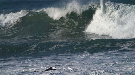 12 Foot High Waves From Storm Appear To Damage Ocean Beach Pier