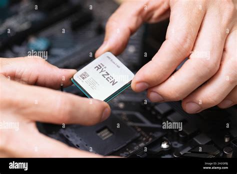 Close Up Of Electronic Engineer Installing Ryzan Microprocessor