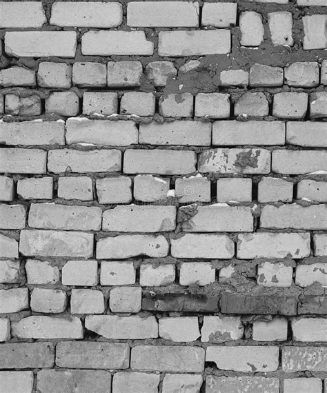 black and white brick wall large gaps between the bricks stock image