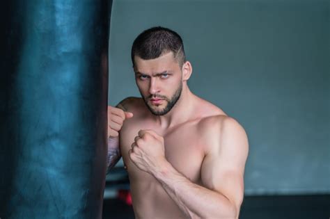 Premium Photo Strong Young Man Boxer Boxing In Gym Sporty Male