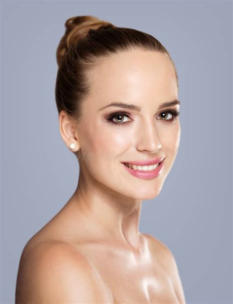 Gorgeous Young Guy With Naked Shoulders Is Posing Confidently Stock