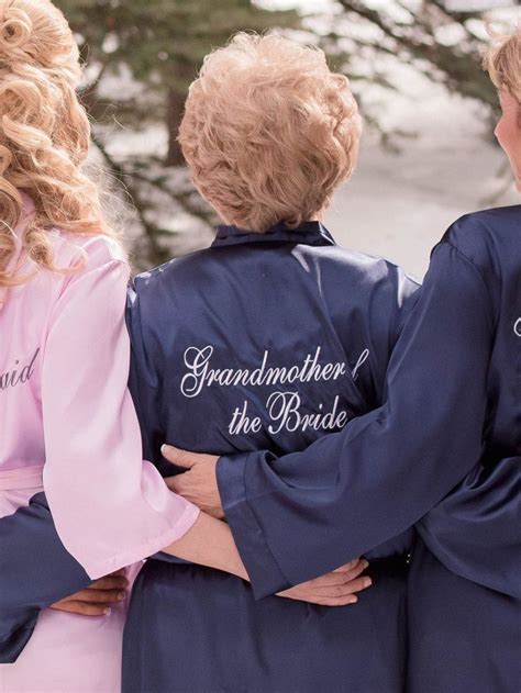Three Bridesmaids In Matching Robes With The Words Grandmother And The