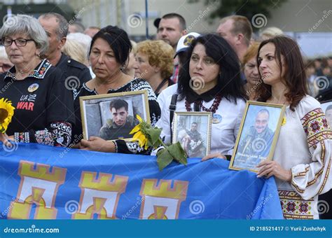 Mourning Women Mothers And Wives Standing And Holding Portraits Of Sons
