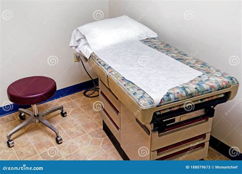 Doctor`s Office Examination Table And Chair Stock Image Image Of