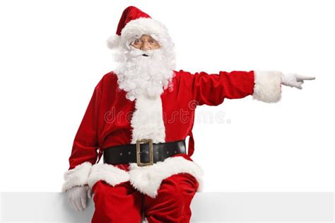 Papai Noel Sentado Em Branco E Apontando Imagem De Stock Imagem De