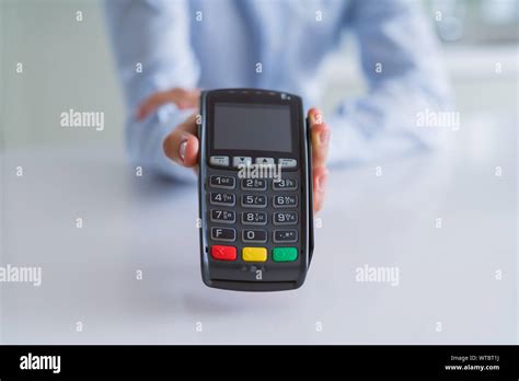 Close Up Of Man Hands Holding Pos Terminal Stock Photo Alamy