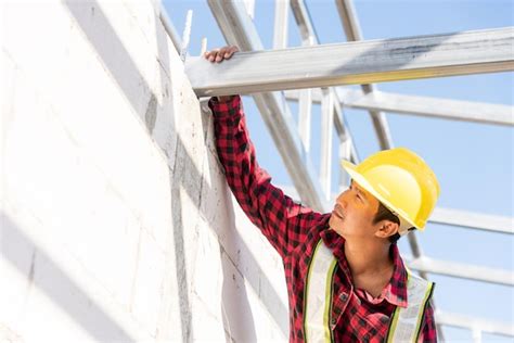 Premium Photo Construction Worker Or Contractor Checking House Frame Premium Photo Construction Worker Or Contractor Checking House Frame