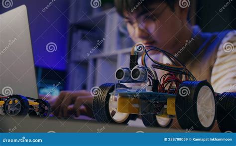 Asian Teenager Doing Arduino Robot Homework Project In House Stock Image Image Of Education