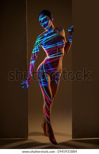 Naked Woman Illuminated By Stripes Neon Stock Photo 1945931884