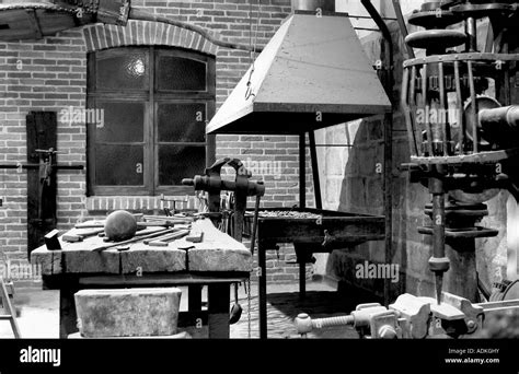 Black And White Picture Of Old Blacksmith Forge Exhibited In Town Stock