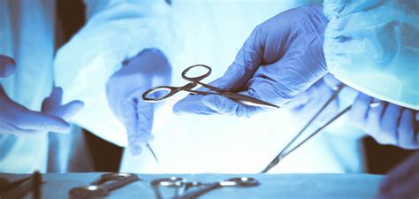 Surgeons Hands Holding Surgical Scissors And Passing Surgical Equipment