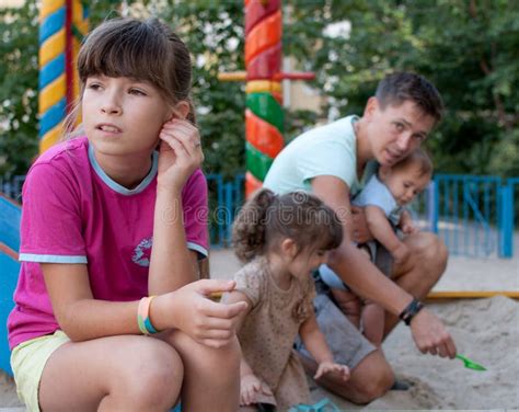 Teenager Girl Jealous Of Her Younger Sister And Brother Stock Image