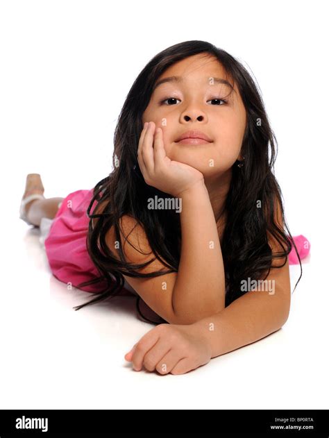 Portrait Of Young Asian Girl Laying On Floor Isolated Over White