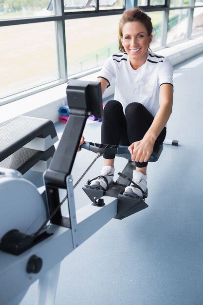 Premium Photo Happy Woman On Rowing Machine