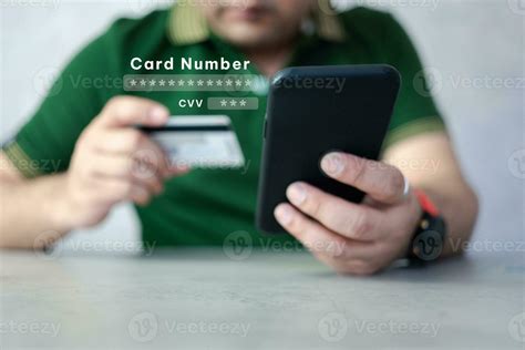 Man Typing A Credit Card Dialing Number And Card Verification Value For