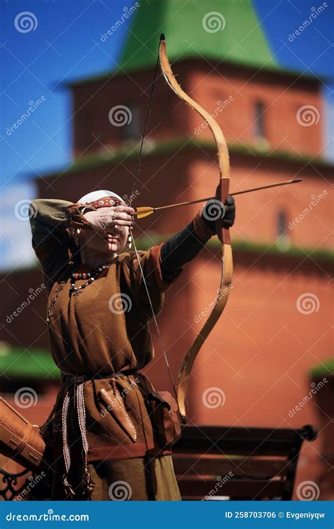 Medieval Archery Tournament A Woman Shoots An Arrow In The Medieval