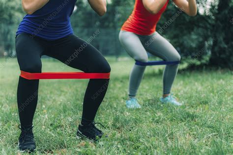 Women Exercising With Elastic Bands In A Park Stock Image F0246322