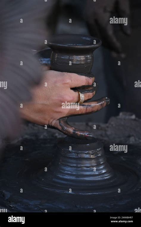 Closeup Of Two Hands Modeling Clay During A Pottery Workshop In Pottery Square In Bhaktapur