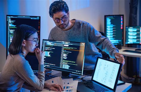 Asian And Indian Developer Devops Team Discussion About Coding Promgram