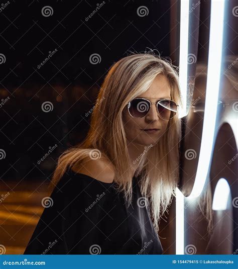Portrait From Side Of Beauty Young Blonde Hair Woman With Neon Light