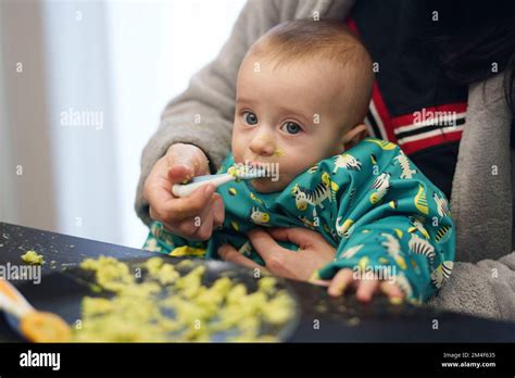 Mother Feeding Her Baby Boy Stock Photo Alamy