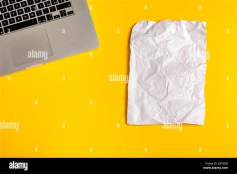 Flat Lay Out Computer On Yellow Background With Crumpled Pape Business Concept Idea Copy