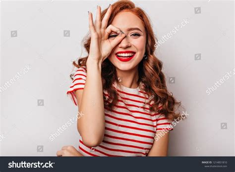 Stunning Ginger Girl With Wavy Hairstyle Expressing Happiness