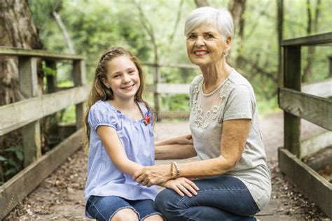 Grandmother And Granddaughter Spend The Weekend In The Park Stock Image Image Of Background