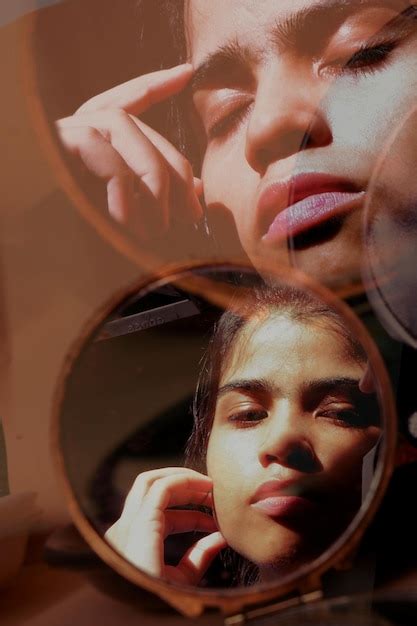 Premium Photo Close Up Of Young Woman Looking In Mirror