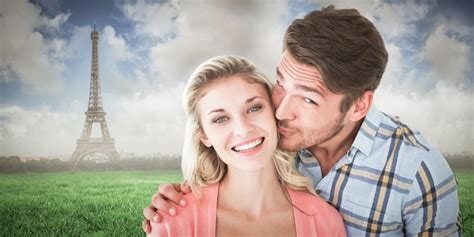 Premium Photo Handsome Man Kissing Girlfriend On Cheek Against Eiffel