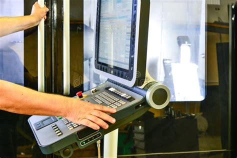 Worker Operator Of The Control Panel Of The Program Of Operation Of A High Precision CNC