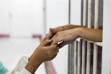 A Woman Is Holding Onto The Hands Of Her Husband Who Has Become A Man