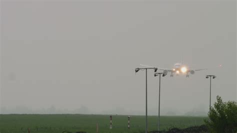 Widebody Airplane Landing On Runway At Rainy Weather Airport Of Almaty