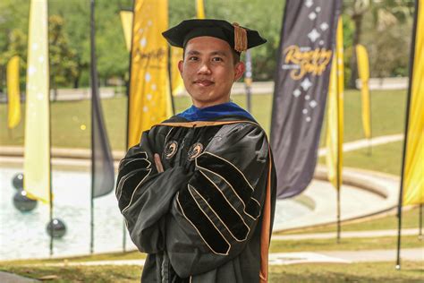 ucf s first ph d in big data analytics walks the commencement stage