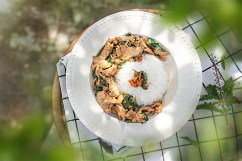 Premium Photo Stir Fried Meat With Chili And Basil Served With
