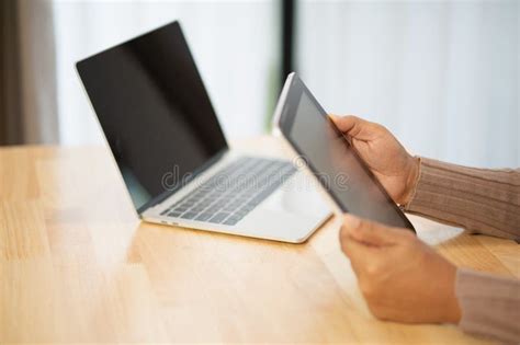 Man Hands Holding Smart Tablet With Laptop Keyboard Young Man Freelance Hands Typing On Laptop