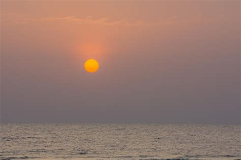 Premium Photo Bright Orange Sun At The Beach On Vacation
