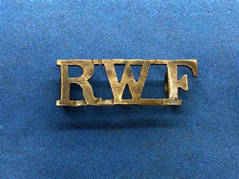 Original Ww2 British Army Royal Welsh Fusiliers Brass Shoulder Title