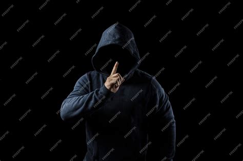 Premium Photo Mysterious Unknown Person In The Hood Danger In Darkness Anonymous Or