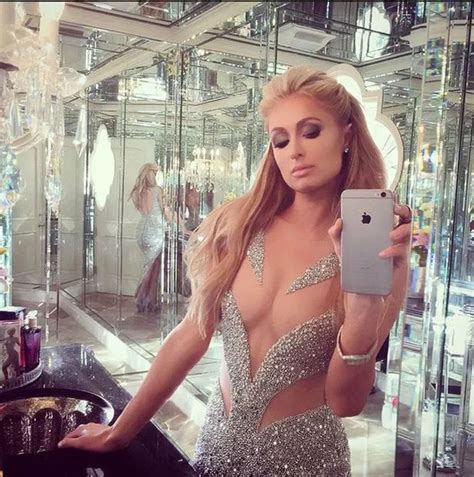 Paris Hilton Flashes Major Cleavage In A Sparkling Silver Gown At The