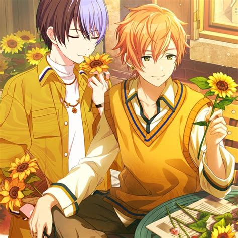 Two People Sitting At A Table With Sunflowers In Front Of Them And One