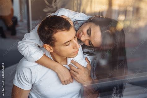 Reflection In Glass In A Mirror Hot Couple In Love Man And Woman Slowly Undress Each Other