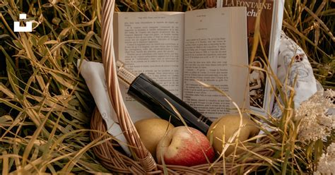 Red Apple Fruit Beside Yellow Round Fruit On Brown Woven Basket Photo