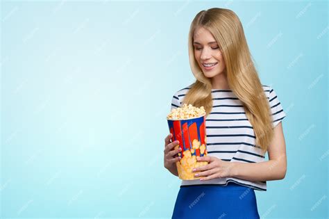 Premium Photo Beautiful Girl Eating Popcorn On White Background
